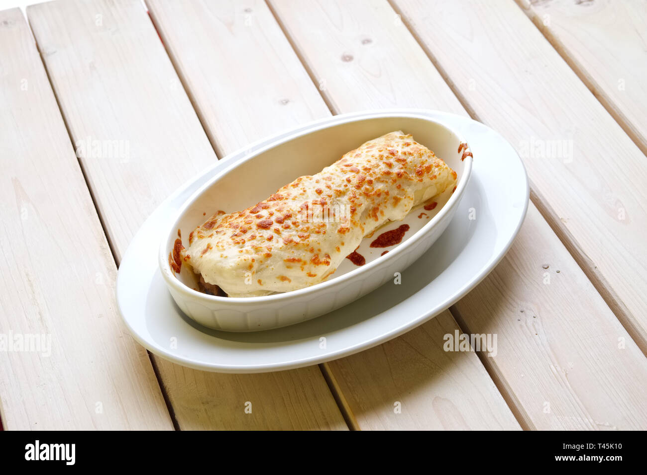 Cheese, mushrooms and sausage baked in pancake Stock Photo - Alamy