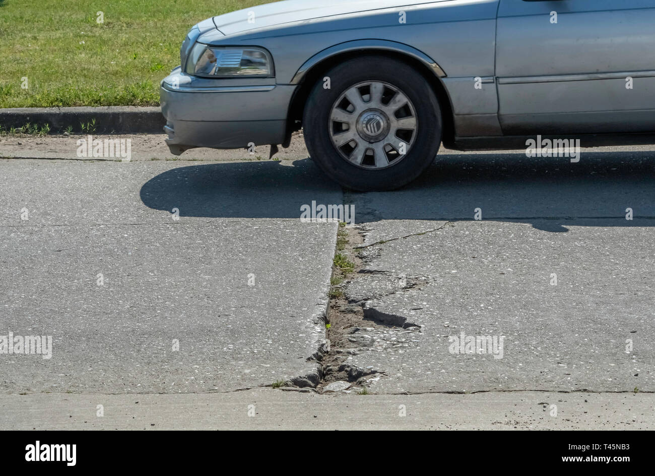 SHREVEPORT, LA., U.S.A. - APRIL 10, 2019: A car drives over a rough ...