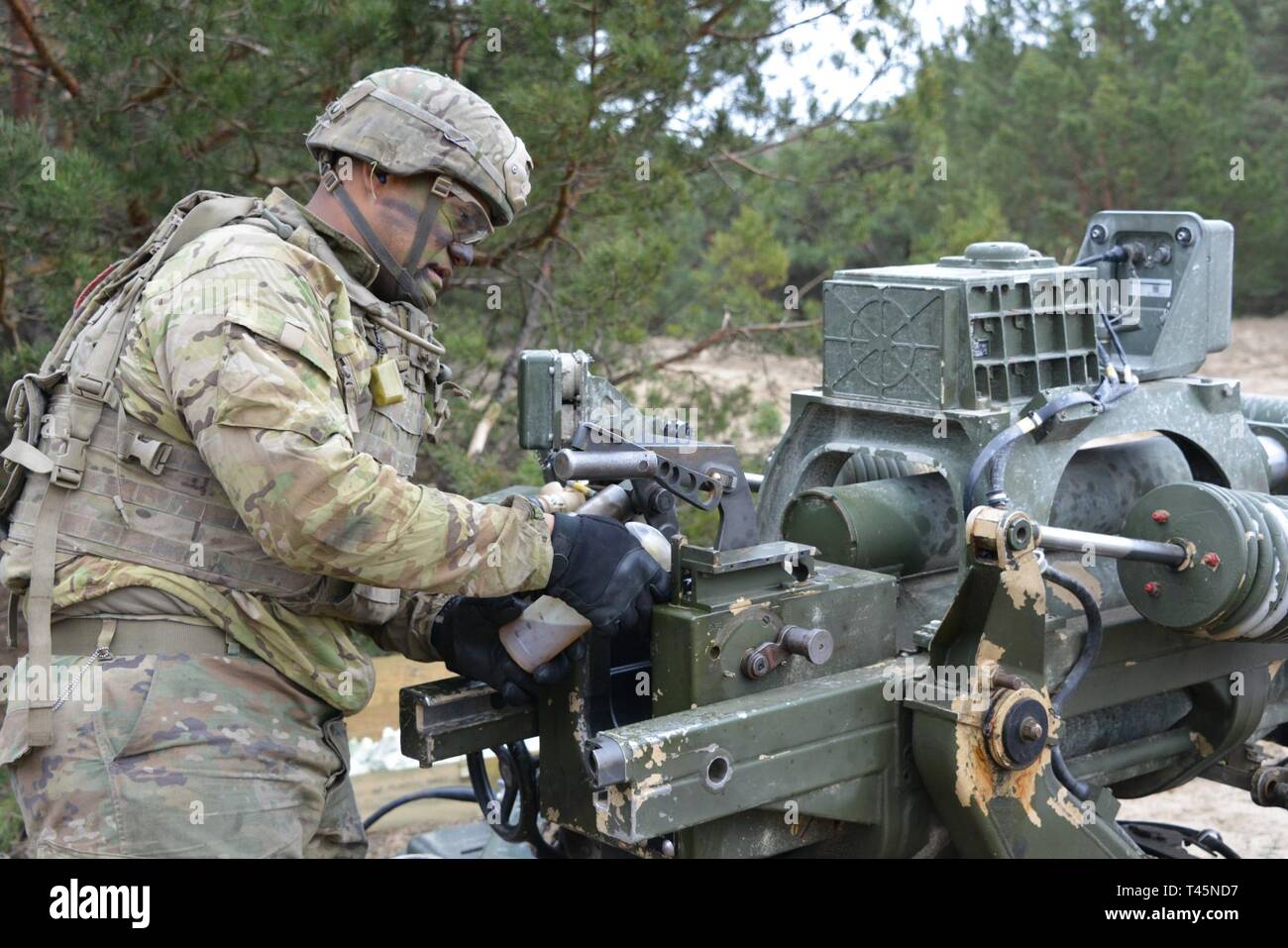 U. S. Army Spc. Adam Lolofie, assigned to A Battery, 4th Battalion ...