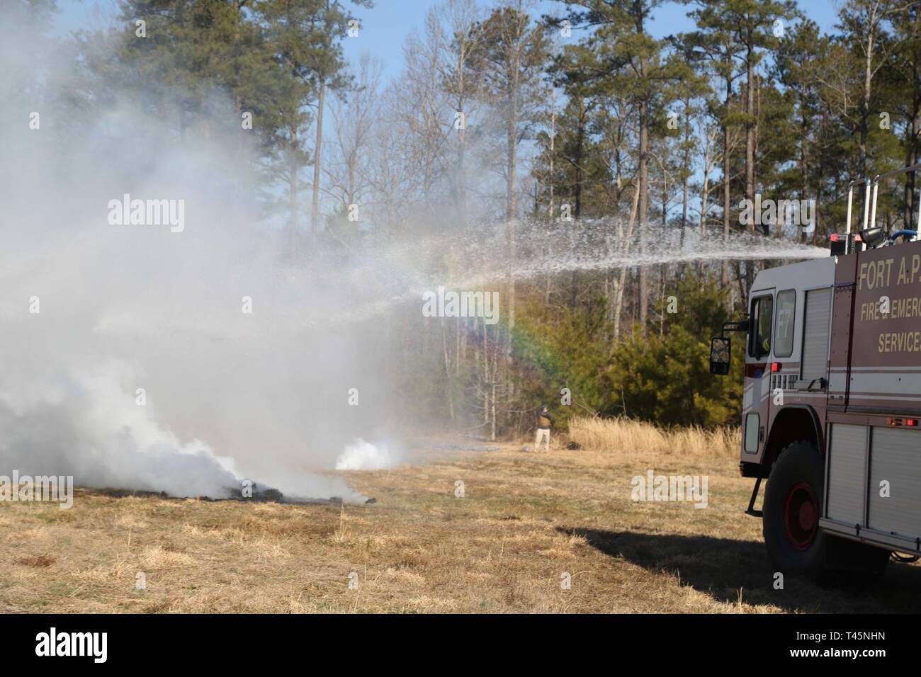 U.S. Firefighter extinguishes a fire during the Hercules Hill & Spill ...