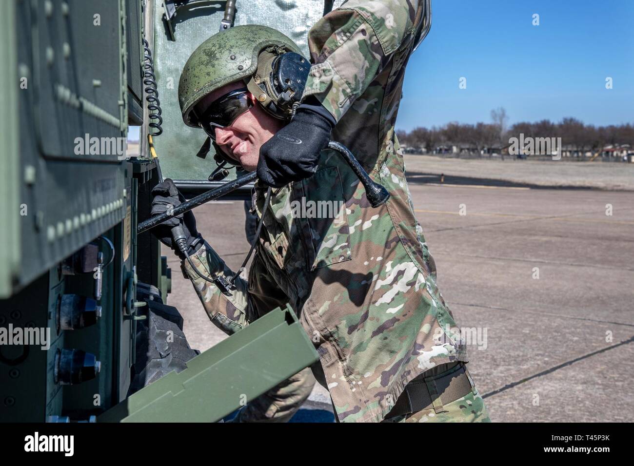 Spc. Zach Fenter, a multiple launch rocket system crewmember, assigned ...