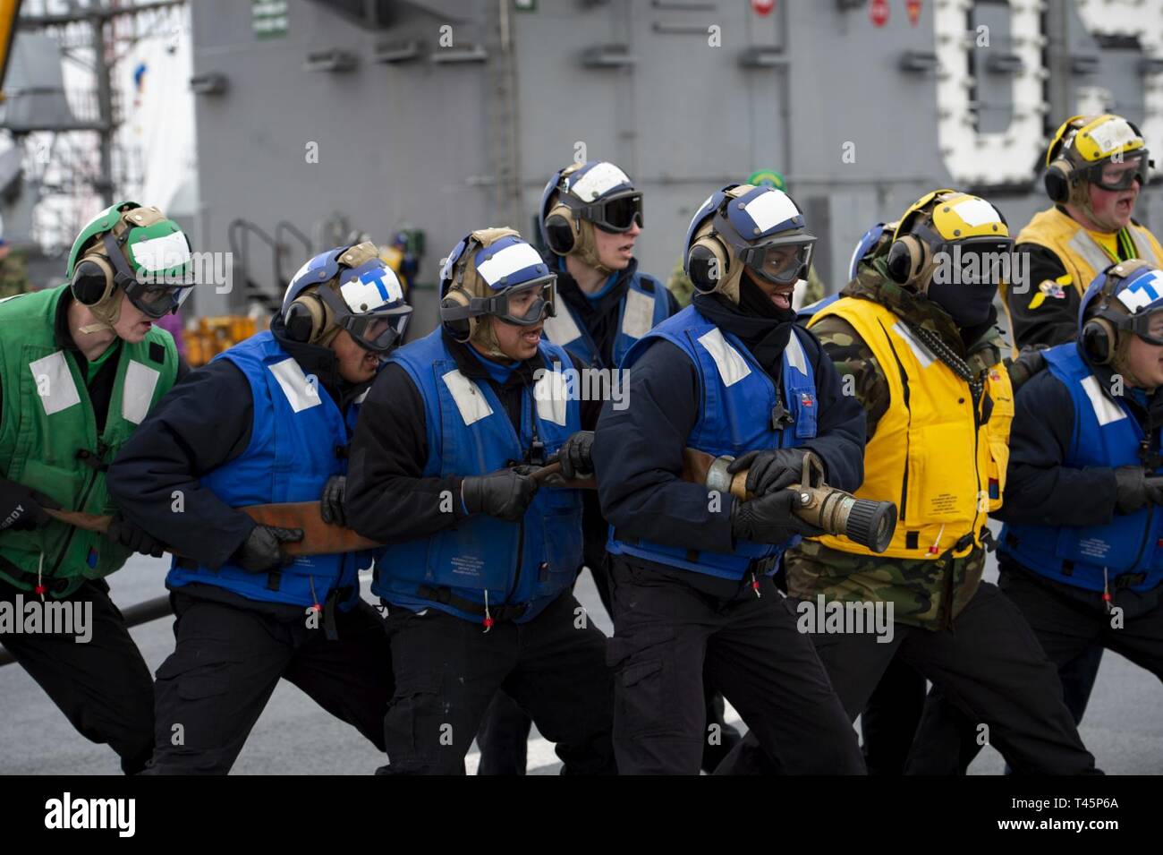 Va. (March 5, 2019) Sailors simulate fighting an aircraft fire during a ...