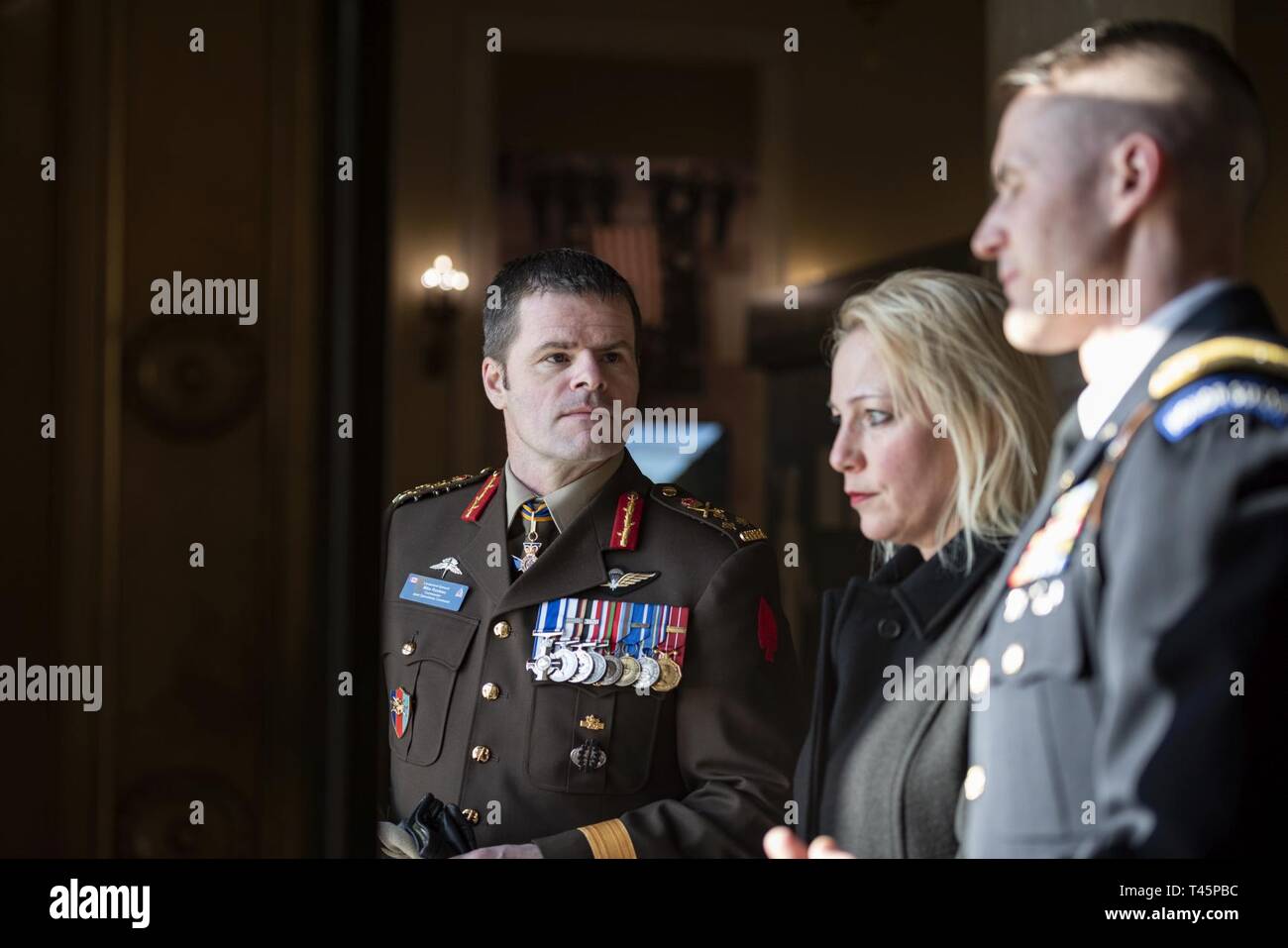 U.S. Army Capt. Victor Farrar (right), commander of the guard, U.S ...