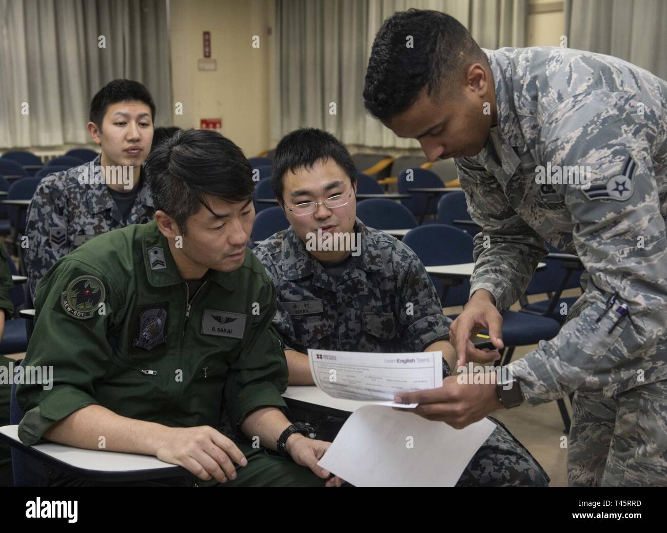 Japan Air Self-Defense Force Tech. Sgt. Ryouta Sakai, left, a 601st ...