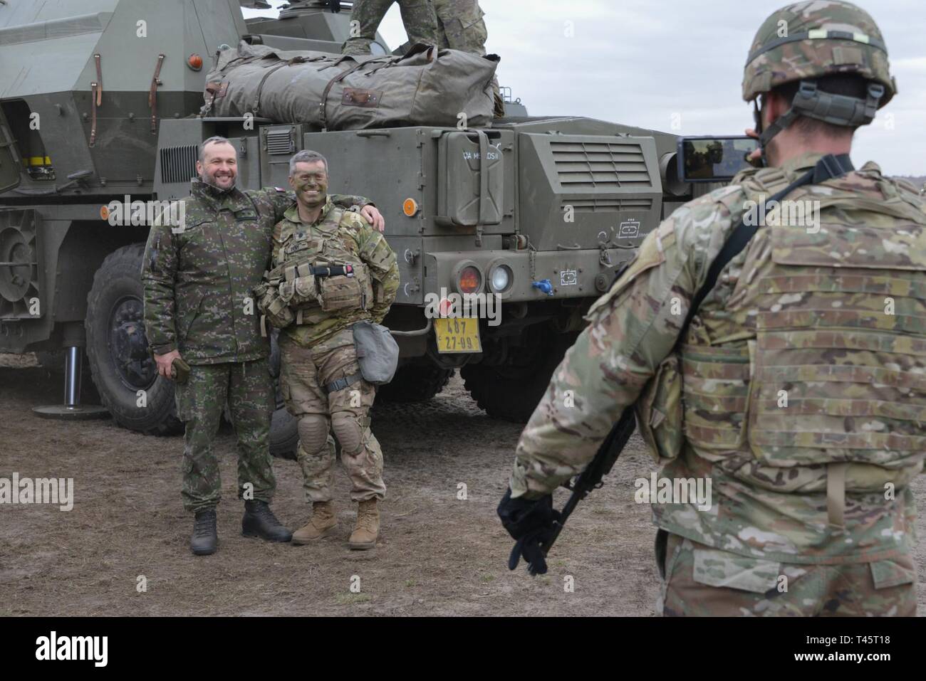U. S. Army Lt. Col. James H. B. Peay IV, center, the commander of the ...
