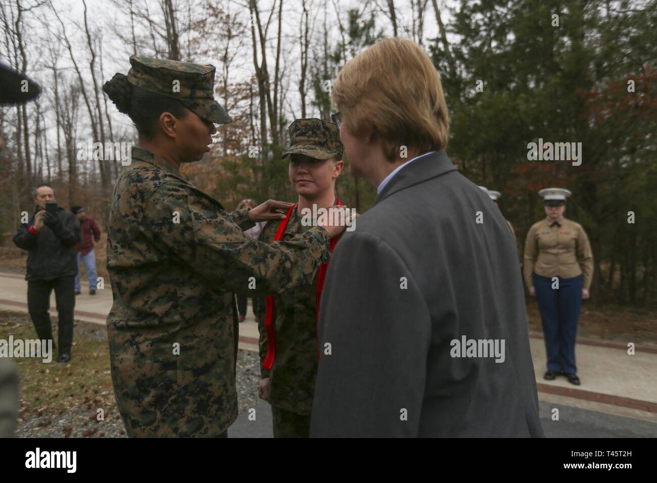 U.S. Marine Corps Cpl. Haley Mathers receives the non-commissioned ...
