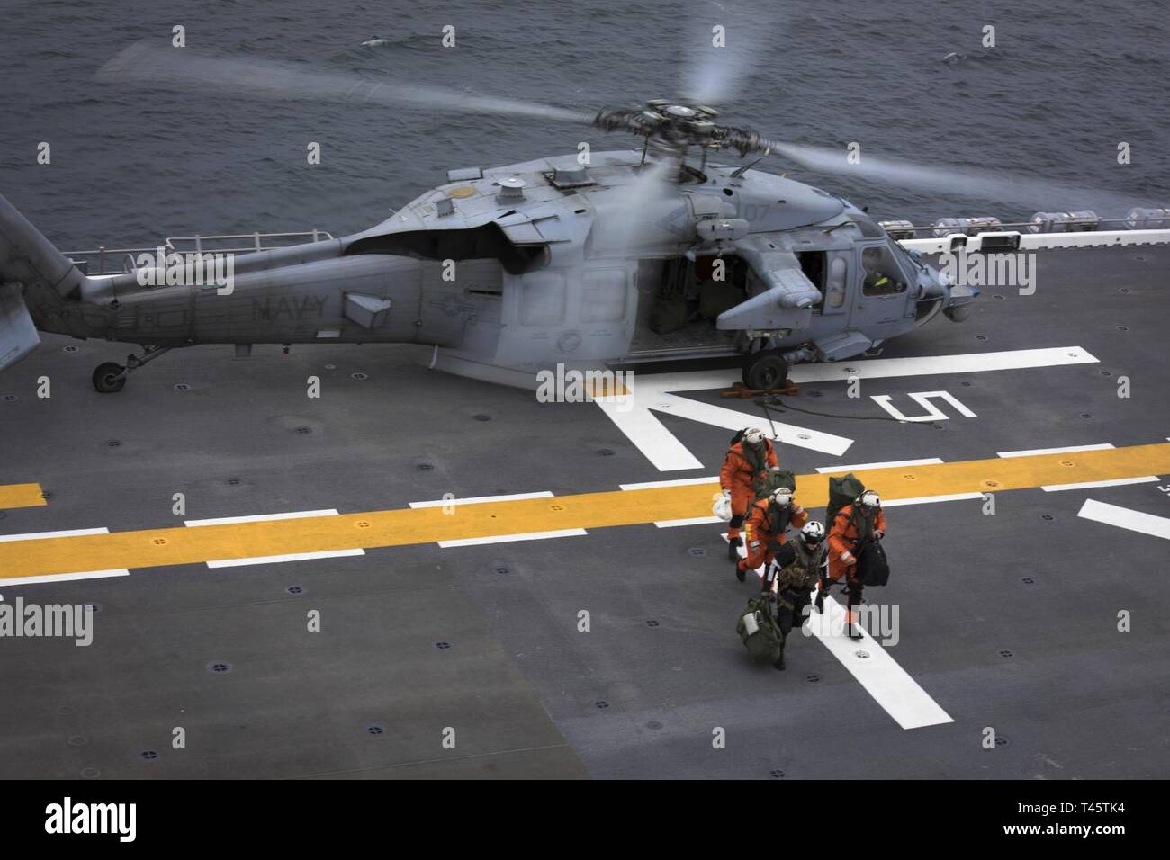 OCEAN (Mar. 8, 2019) An MH-60S Sea Hawk lands on the flight deck aboard ...