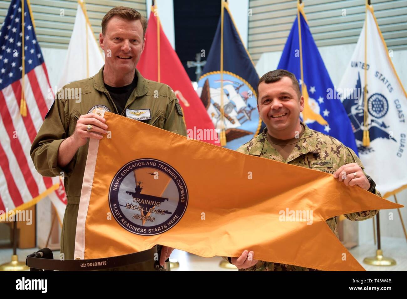 PENSACOLA, Fla. (March 8, 2019) Rear Adm. Kyle Cozad (left), commander ...