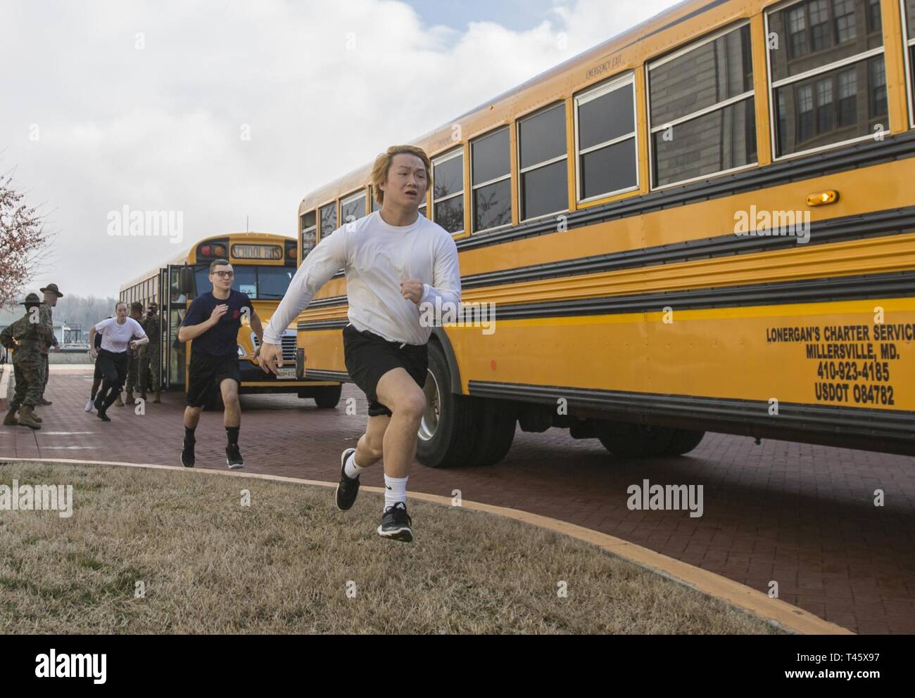 A member of the U.S. Marine Corps Delayed Entry Program sprints to a ...
