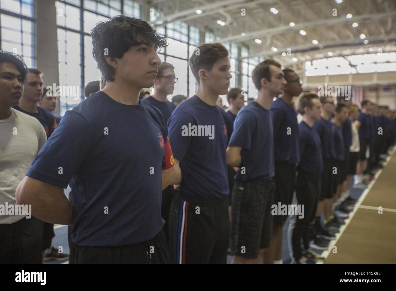 Members of the U.S. Marine Corps Delayed Entry Program stand at parade ...