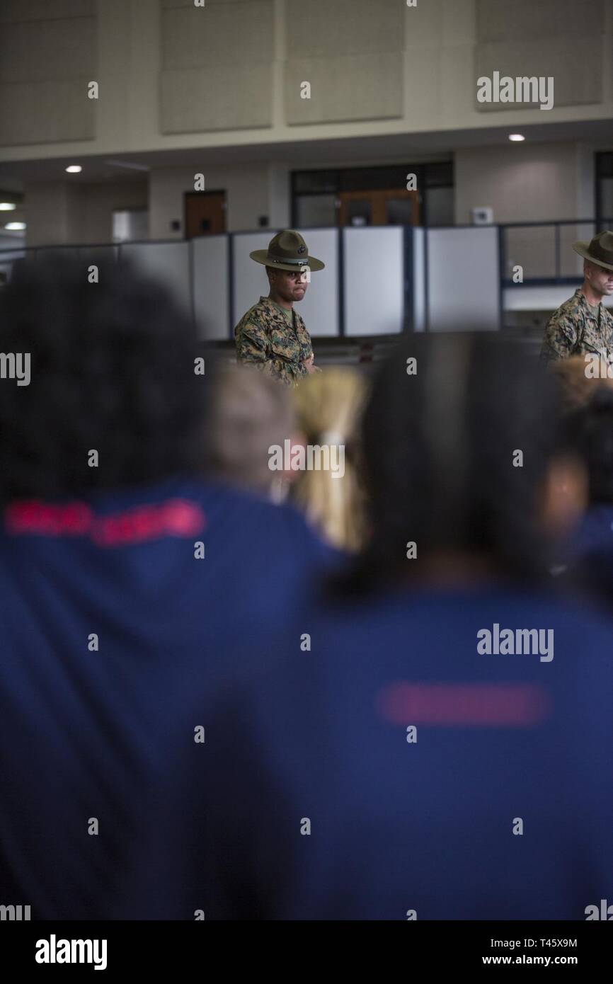 U.S. Marine Corps drill instructor Staff Sgt. Kemmala Kelsey surveys ...