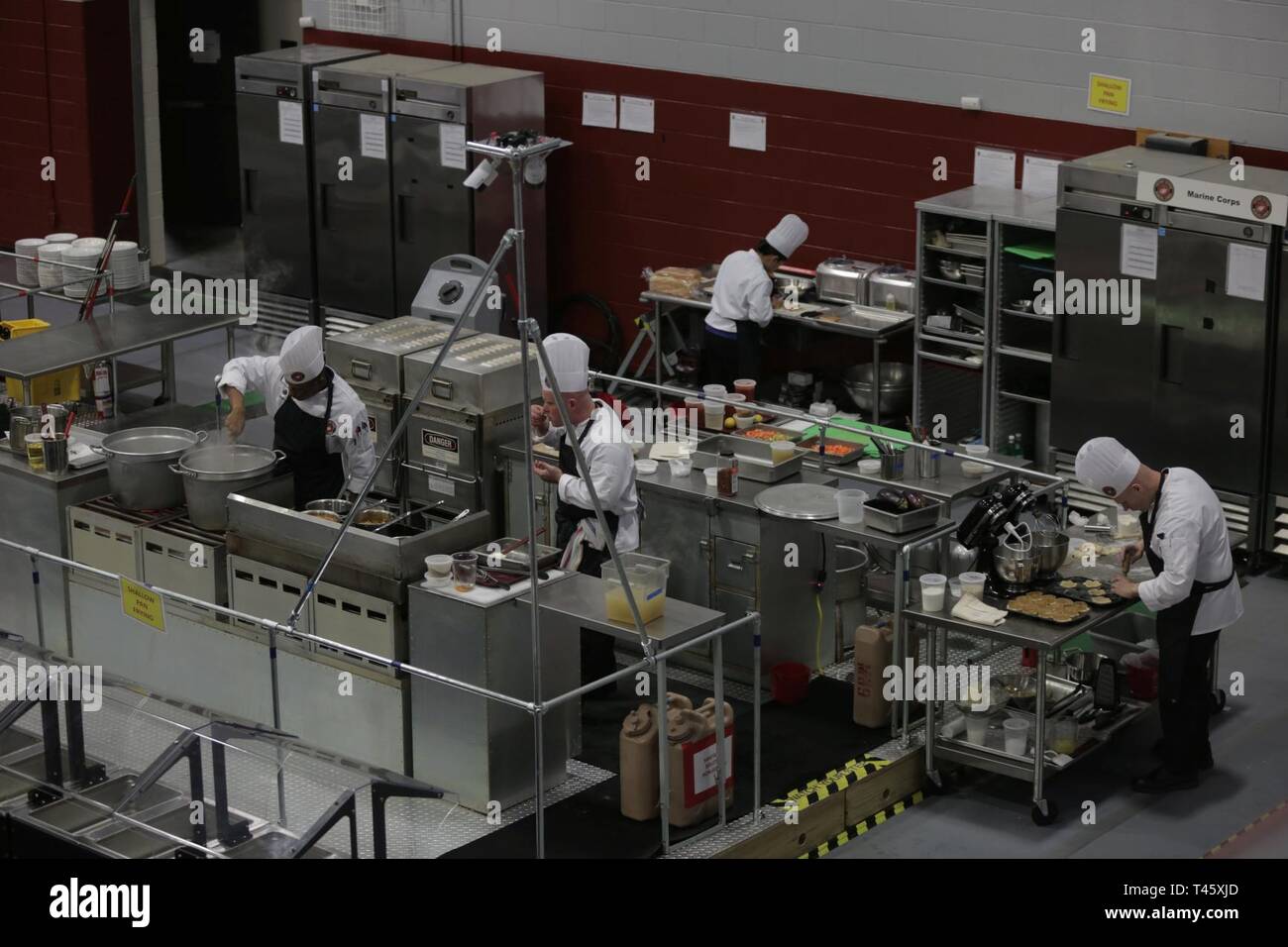 The U.S. Marine Corps Food Service Team prepares food during the 44th ...