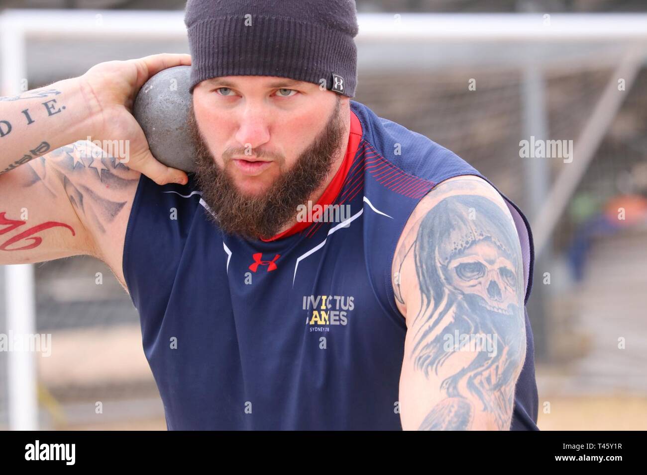 Retired Army Staff Sgt. Ross Alewine clutches the shot put in deep ...