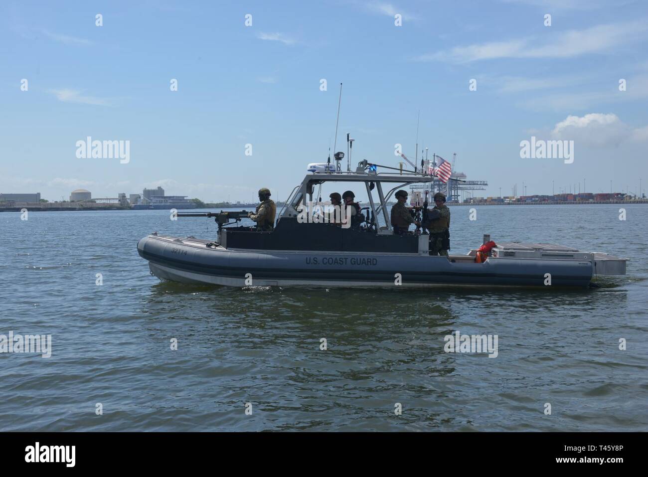 Coast Guardsmen from Port Security Unit 301 waterside division aboard a ...