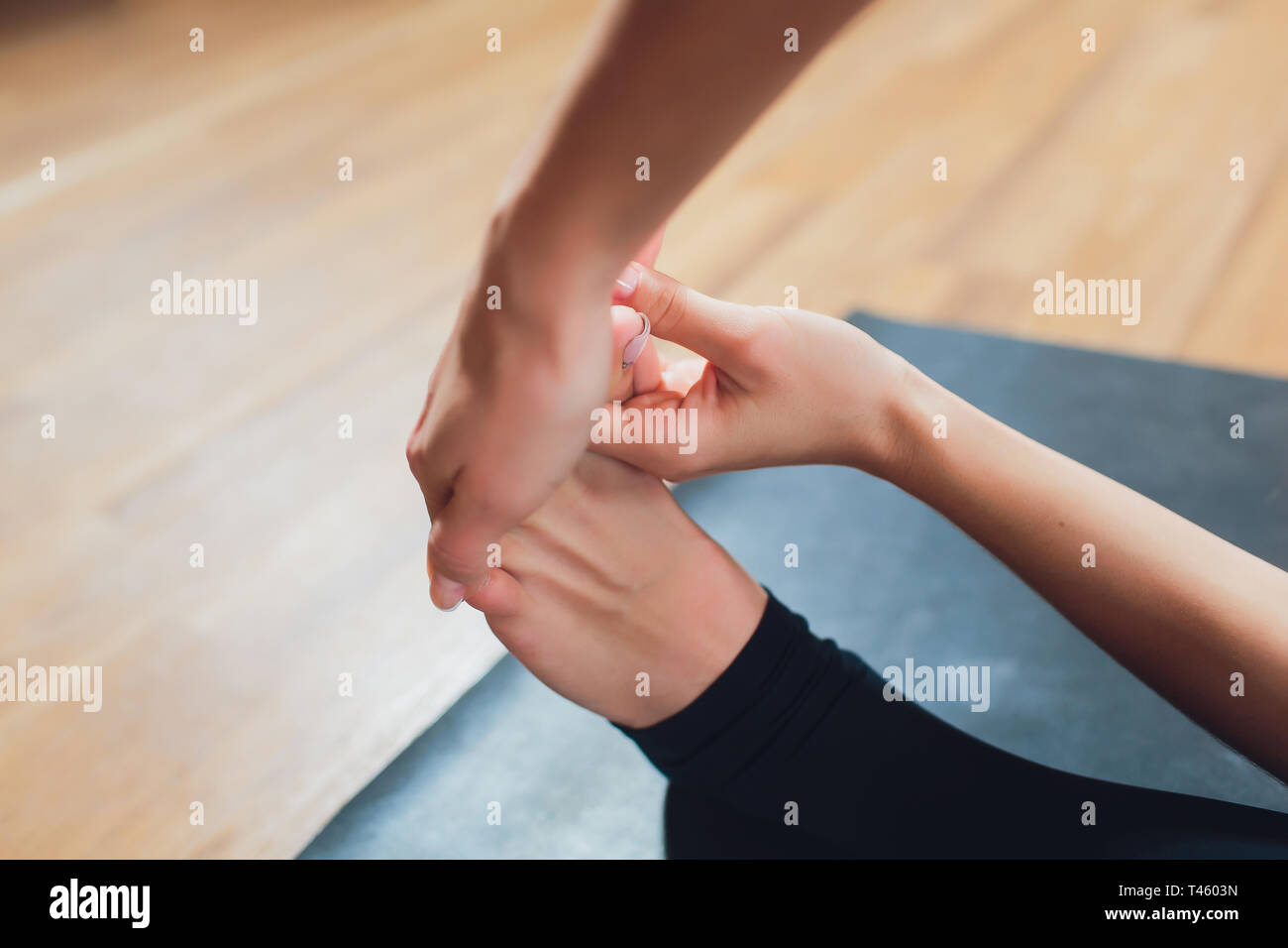 Young woman practicing yoga, stretching in variation of Reverse Table ...