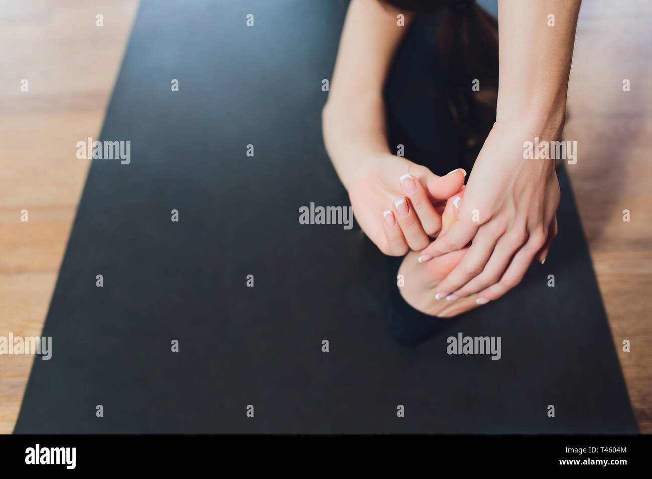 Young woman practicing yoga, stretching in variation of Reverse Table ...