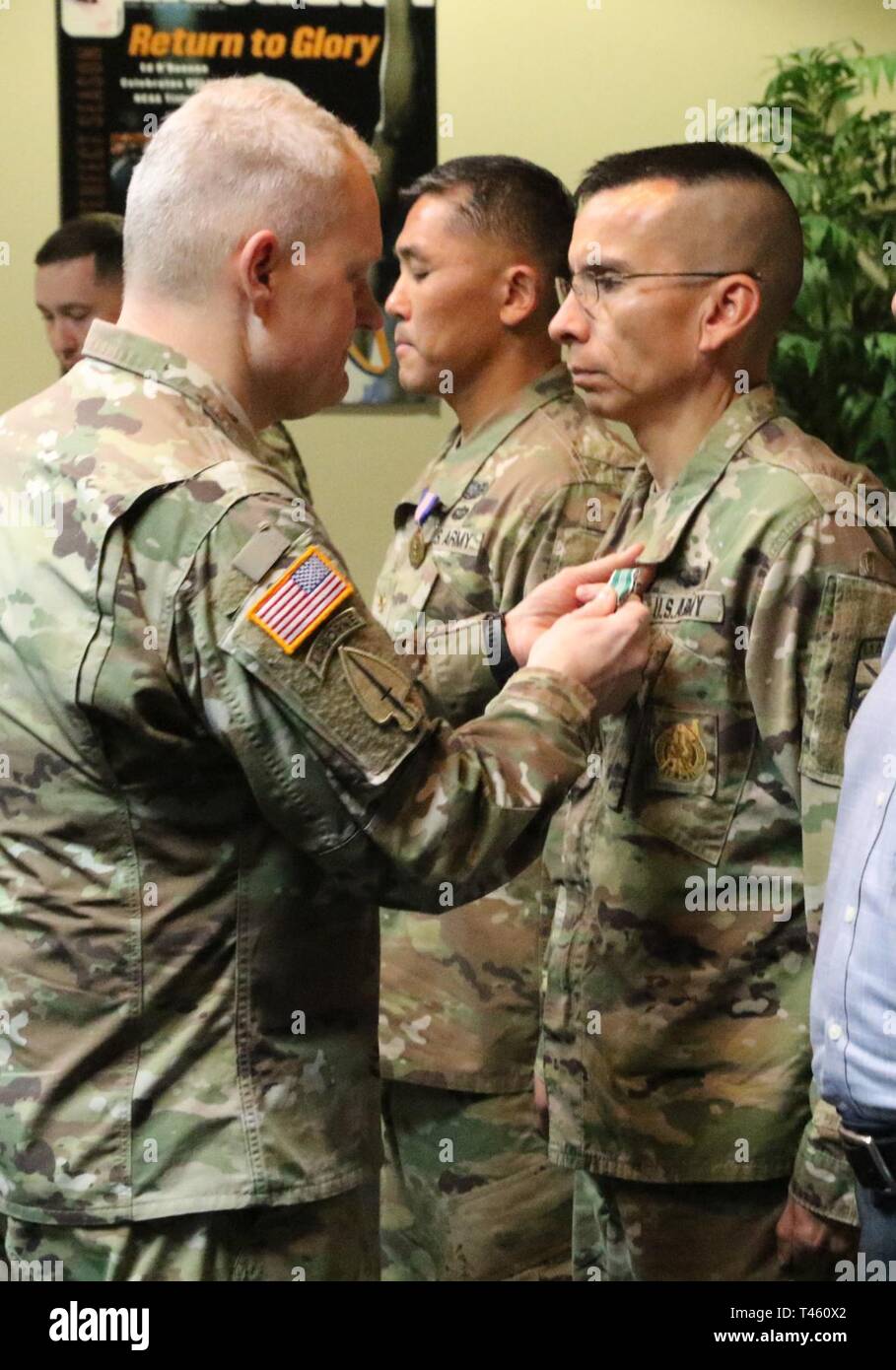 Maj. Gen. John Evans, commander of U.S. Army Cadet Command, presents ...
