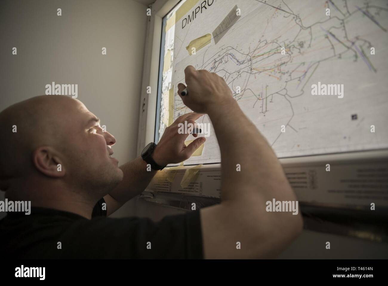 Zagan, Poland - Soldier examines one of the reference maps for his ...