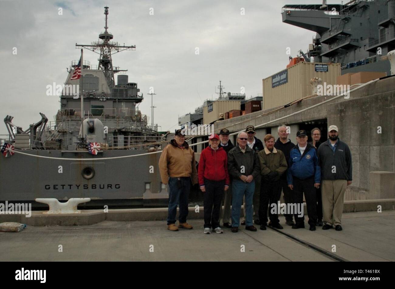 Volunteers and staff members with the Hampton Roads Naval Museum pose ...