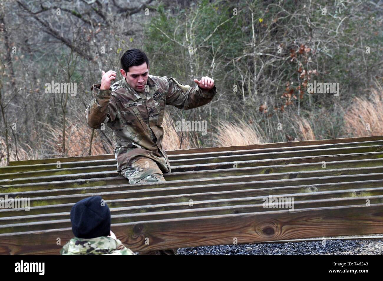 A Texas Army National Guardsman participates in the obstacle course ...