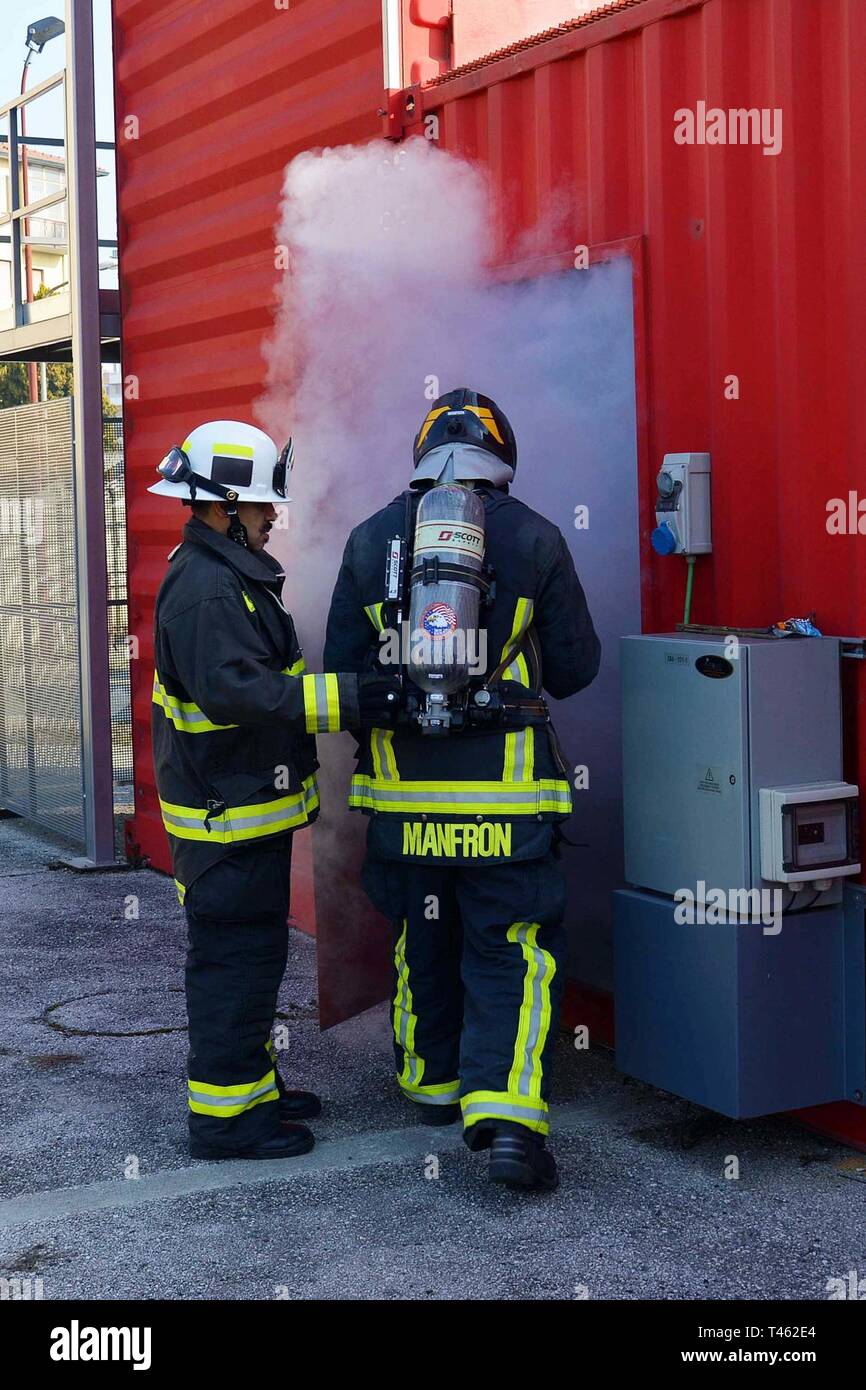 U.S. Army Garrison Italy and Italian firefighters go inside a container ...