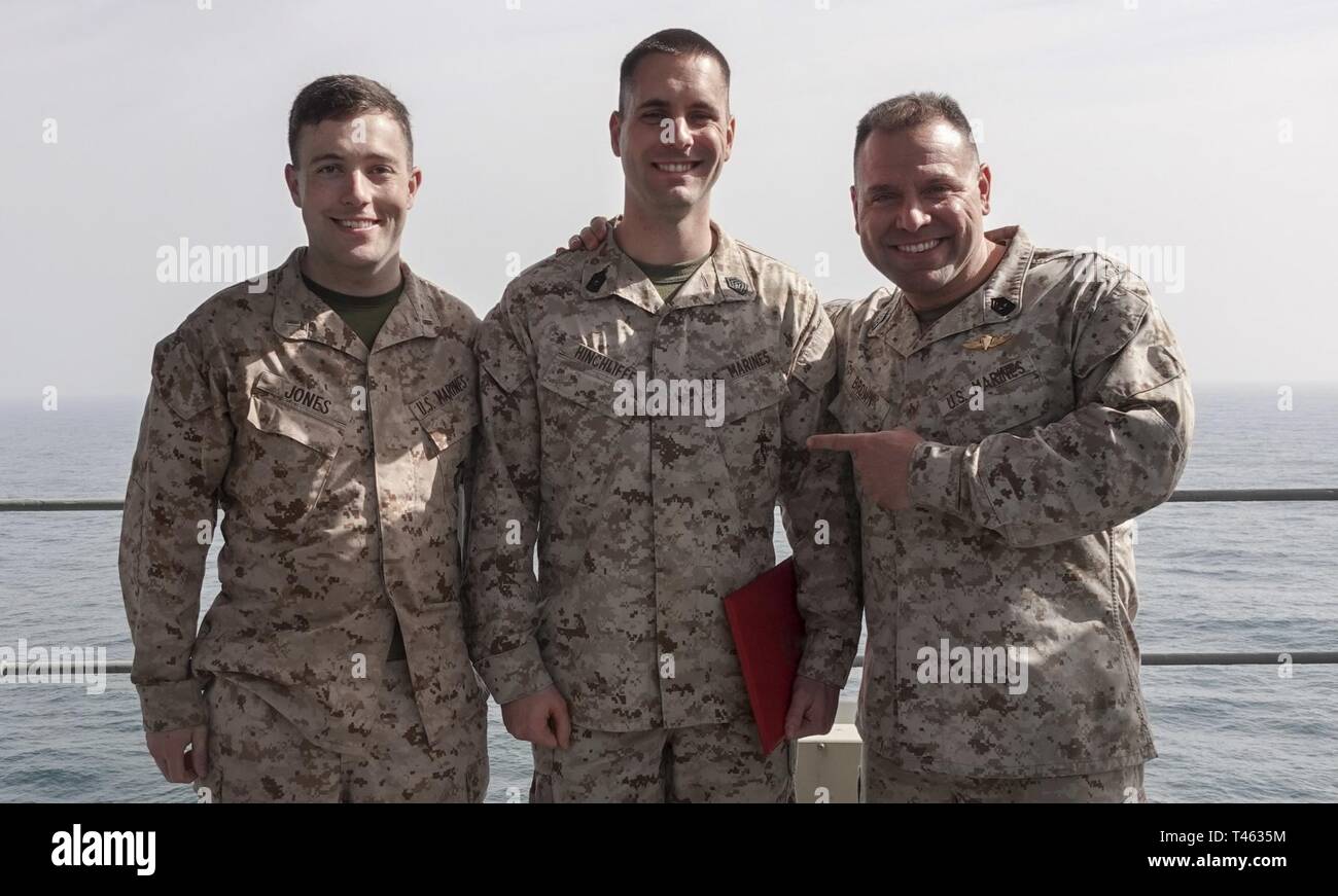 U.S. Marine Corps Master Sgt. Michael Hinchliffe, center, intelligence ...