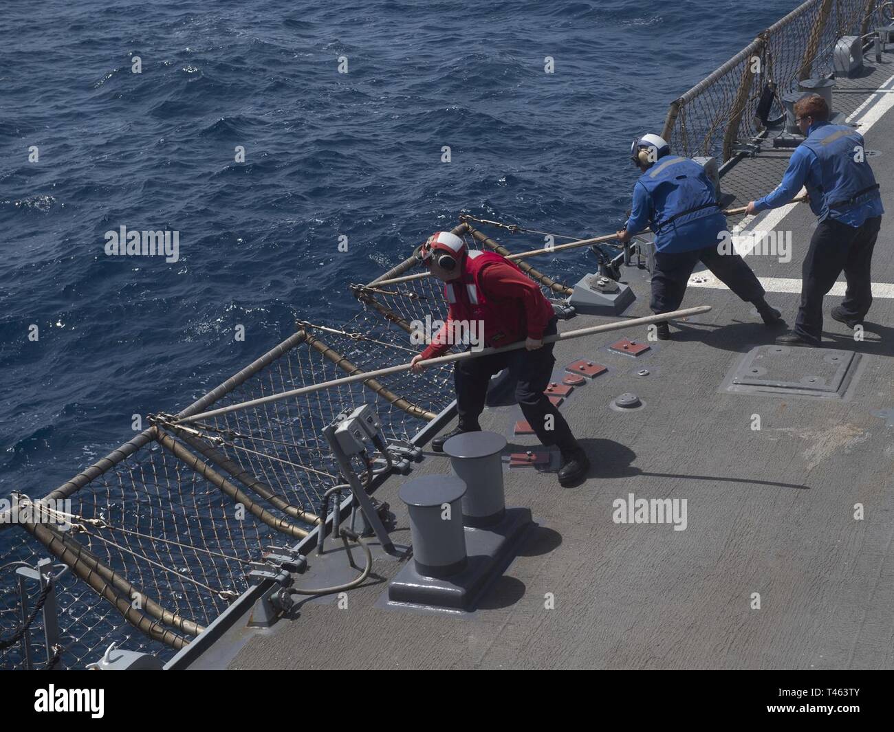 GULF OF ADEN (March 1, 2019) Sailors lower flight deck safety nets ...