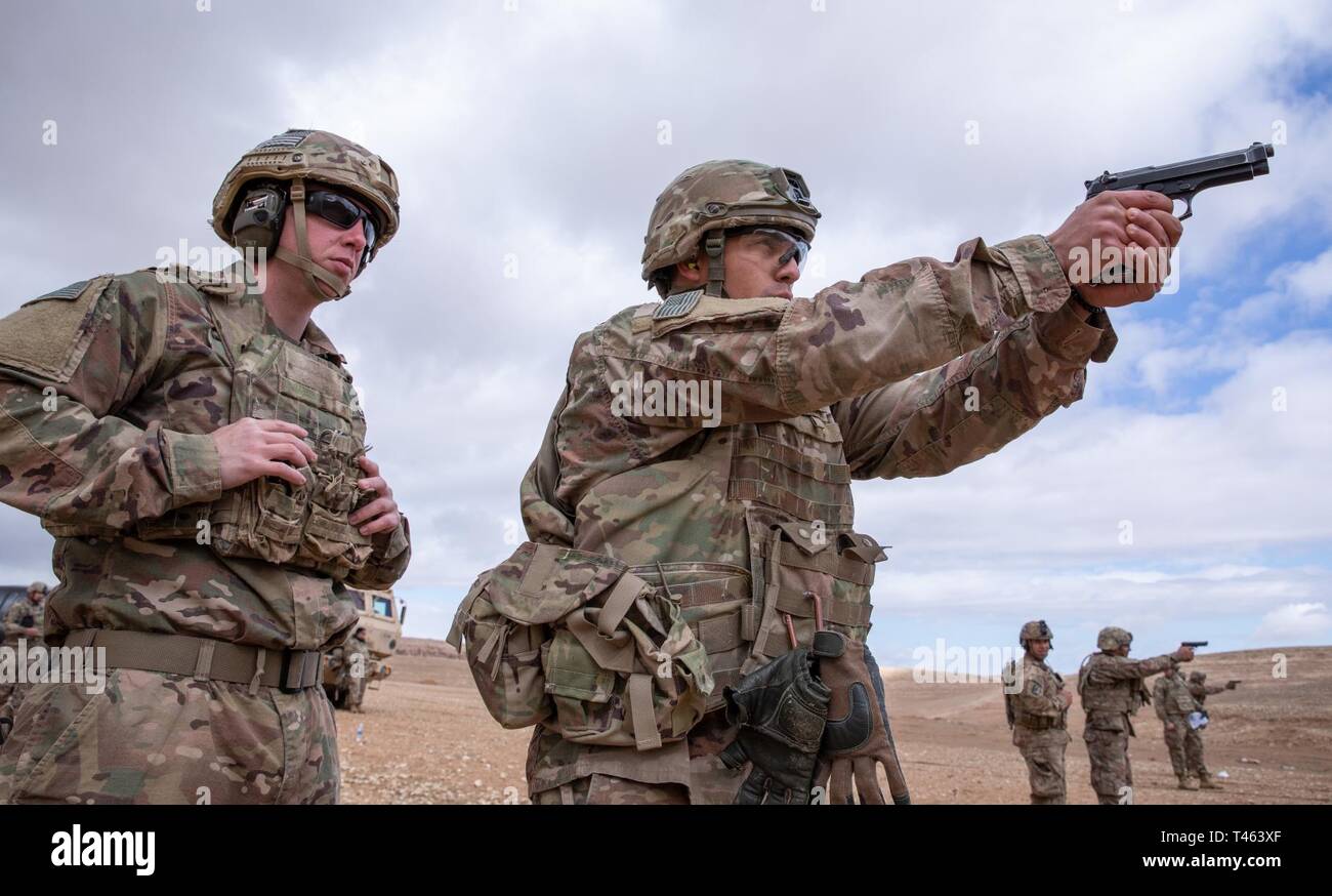 U.S. Army Soldiers fire M9 pistols at paper targets 20 meters away ...