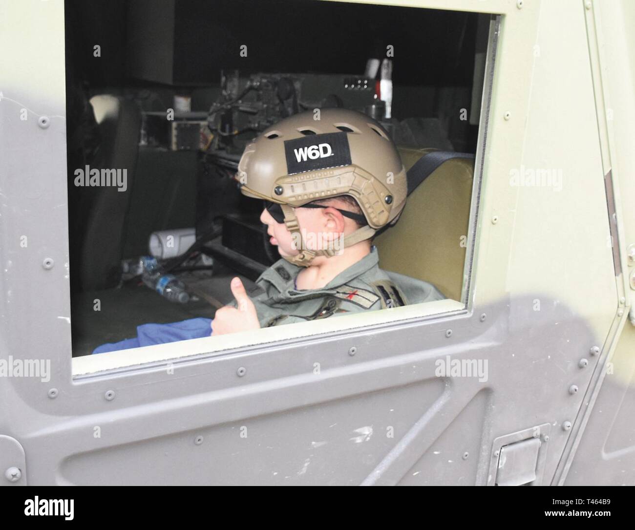 Drake Quibodeaux, 8, a youngster from Vinton, La., his father, gives a ...