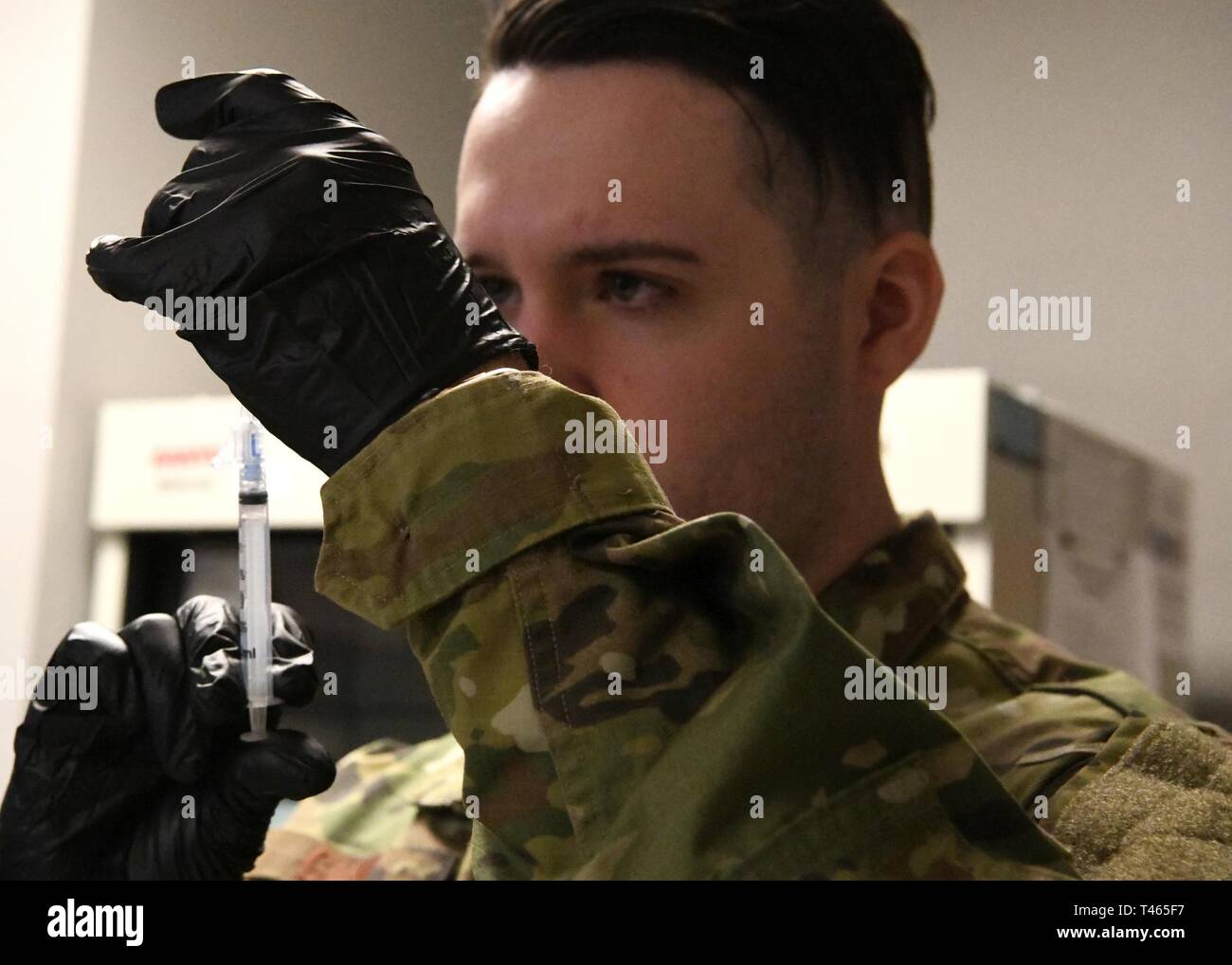 Senior Airman Alan Guin, 104th Medical Group Airman, prepares to ...