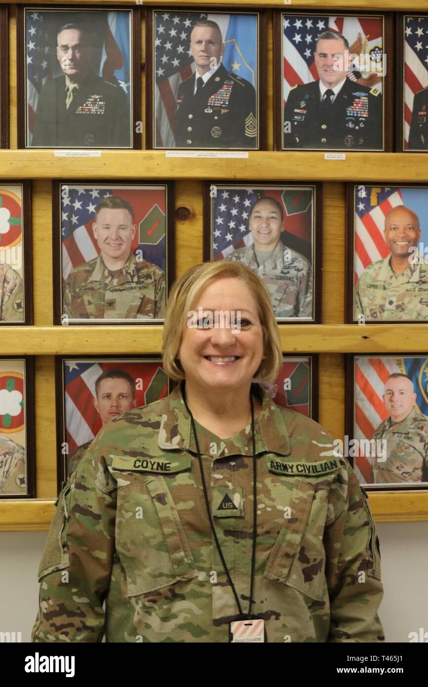 Department of the Army Civilian Ms. Patricia Coyne poses underneath a ...