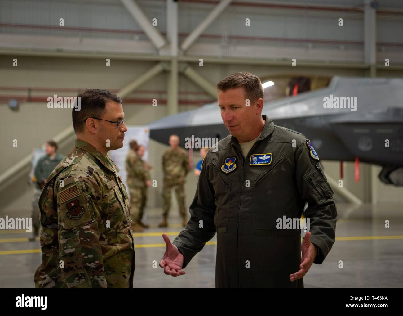 Maj. Gen. Patrick Doherty, 19th Air Force commander, talks with Col ...