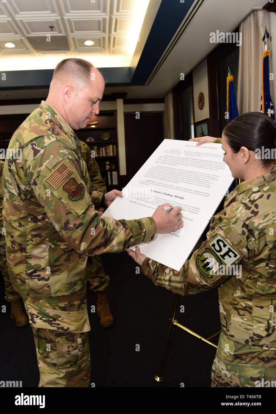 Brig. Gen. John J. Nichols, the 509th Bomb Wing commander, signs the ...