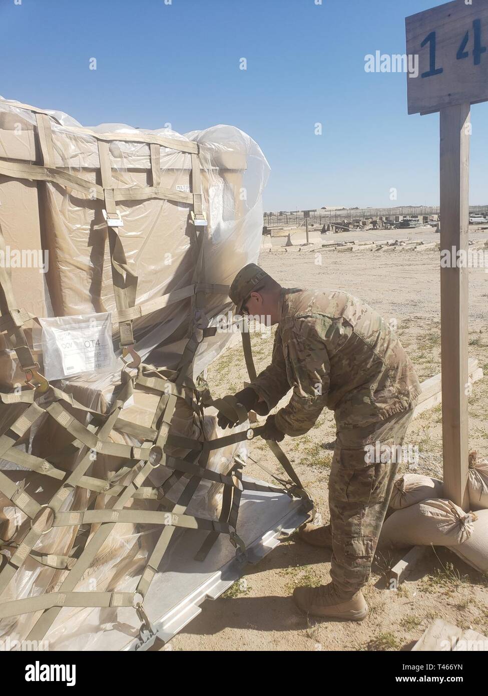 Spc. David Wallace, 949th Movement Control Team, assists in rebuilding ...