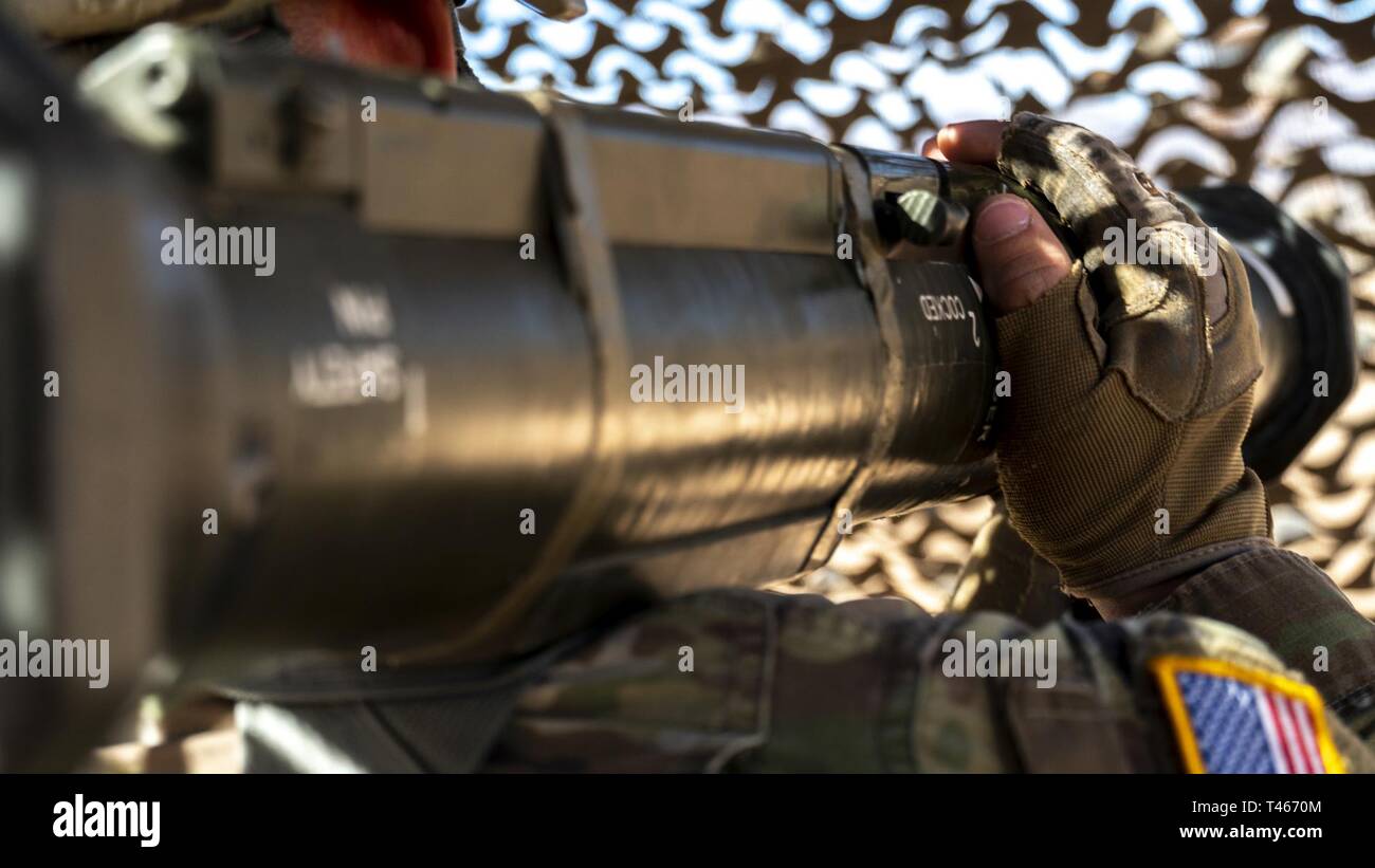 A contestant in the Expert Infantryman Badge competition familiarizes ...