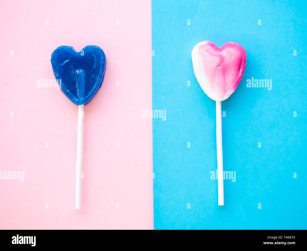 Pink and white and blue lollipops on a pink and blue background Stock ...