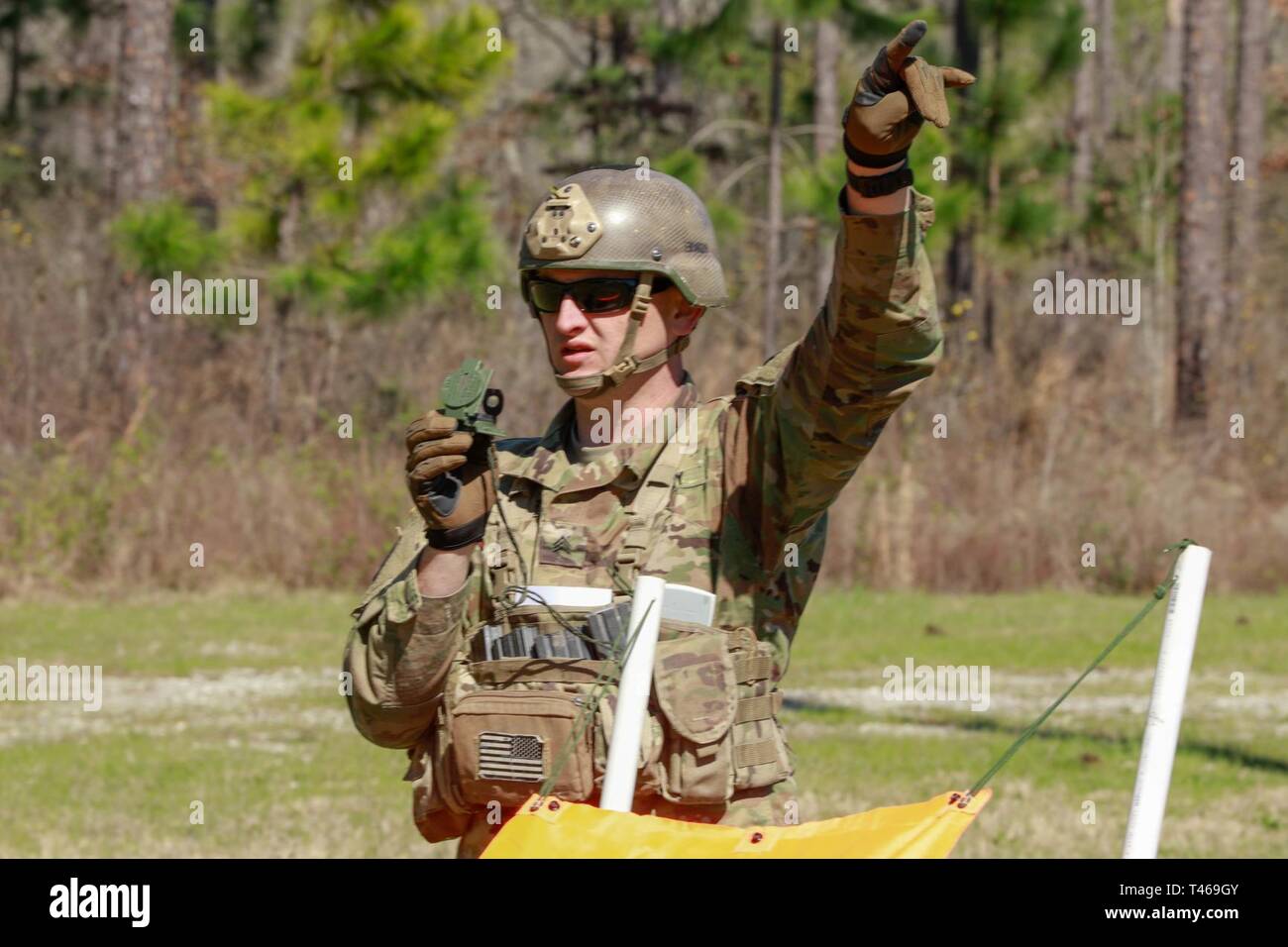 U.S. Army Sgt. Jake Breder sets up a drop zone in a field located on ...