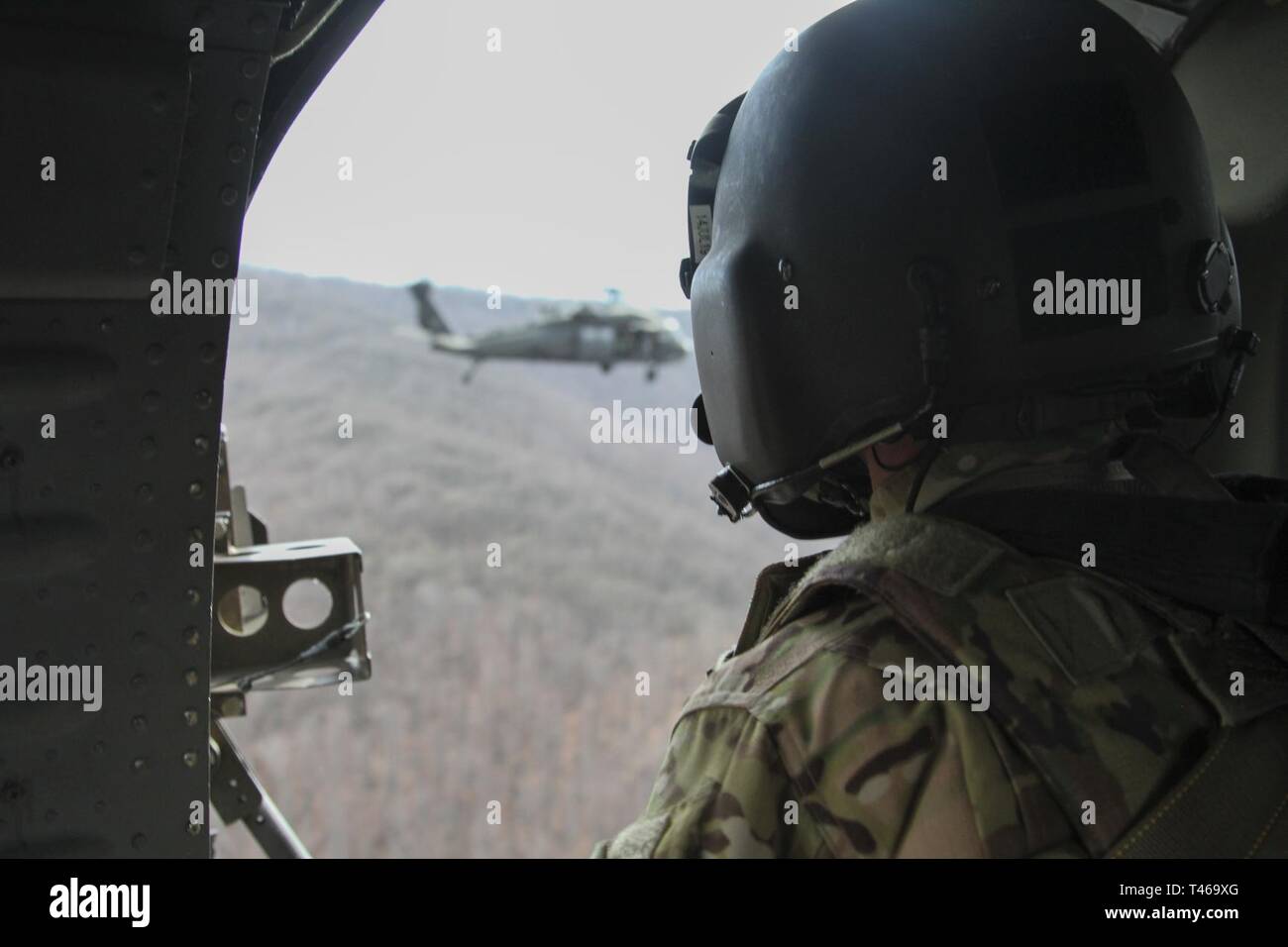 A soldier from 3rd Assault Helicopter Battalion, 1st Aviation Regiment ...