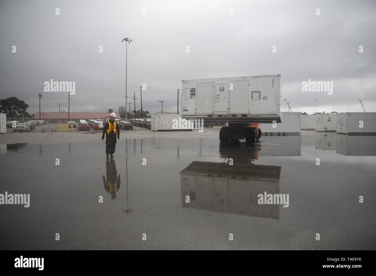 Forklift operators stage mobile facilities to be loaded on the S.S ...