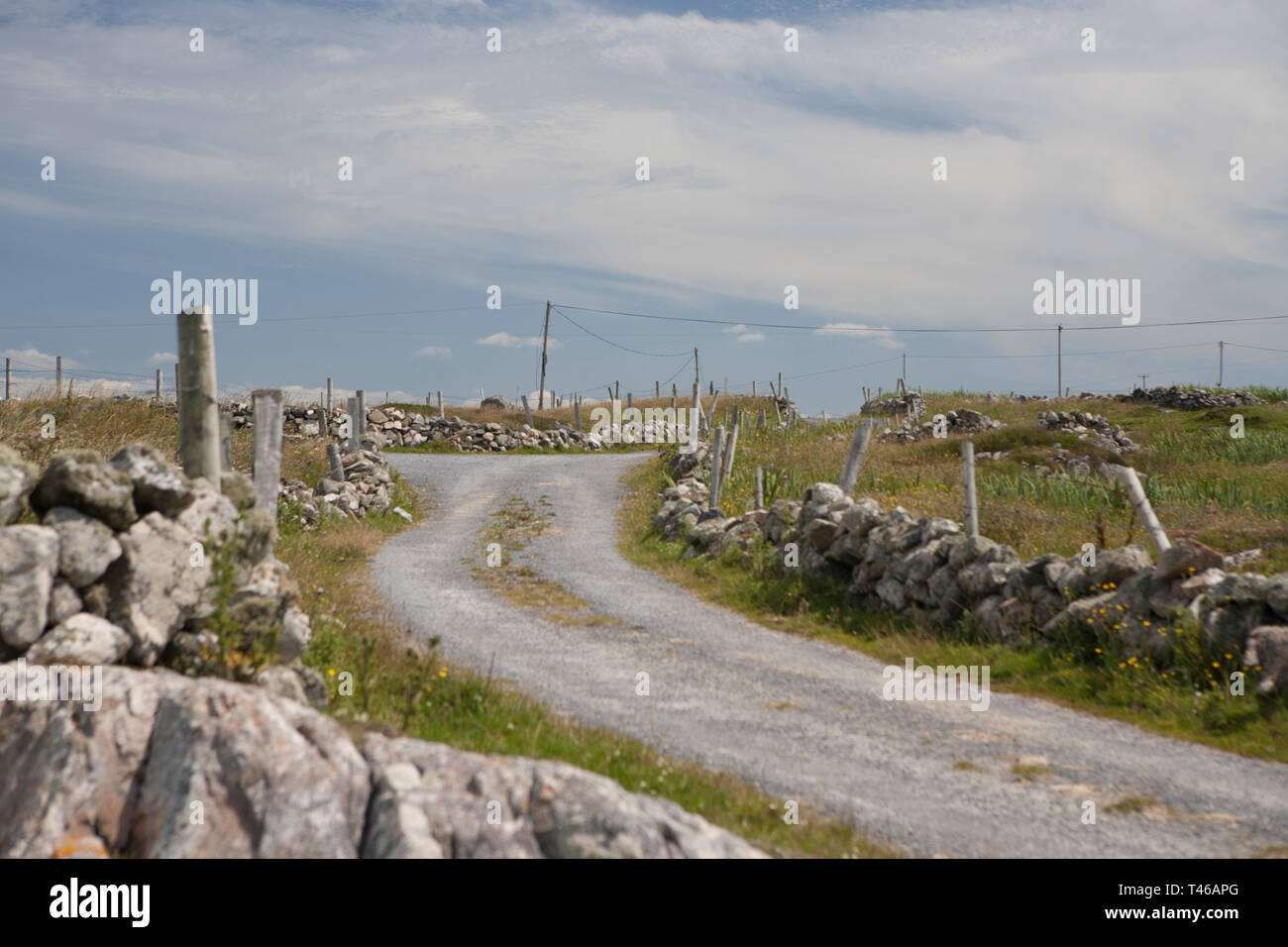 Scenic Irish country road with stone walls Stock Photo - Alamy