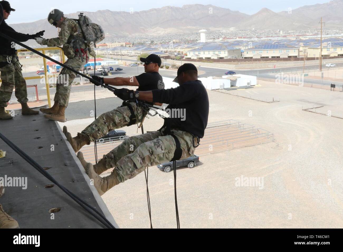 Instructors rappel with students from a 34-foot tower during the Air ...