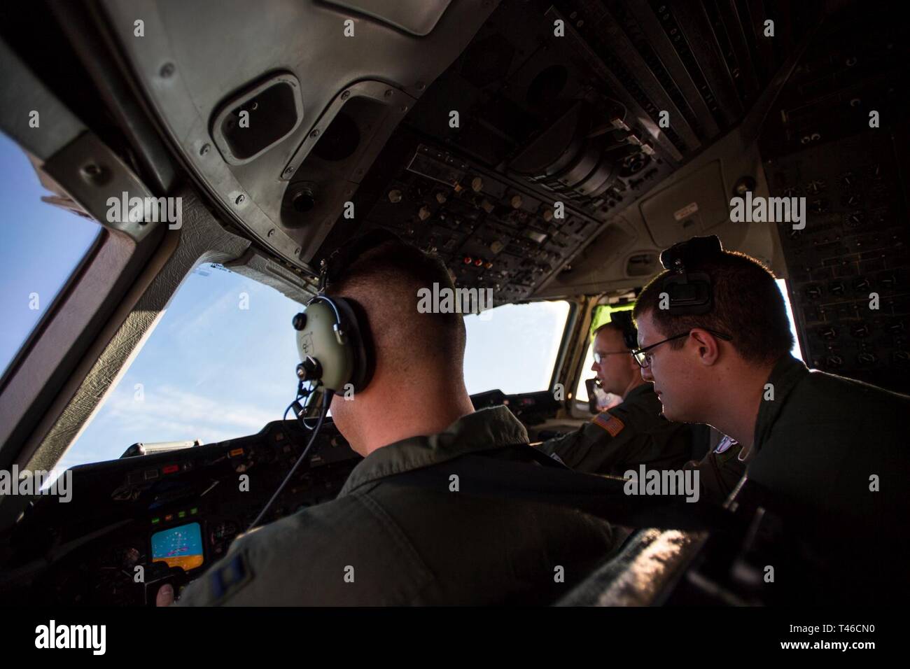 U.S. Air Force Senior Airman Sean O'Brien, center, 60th Operations ...