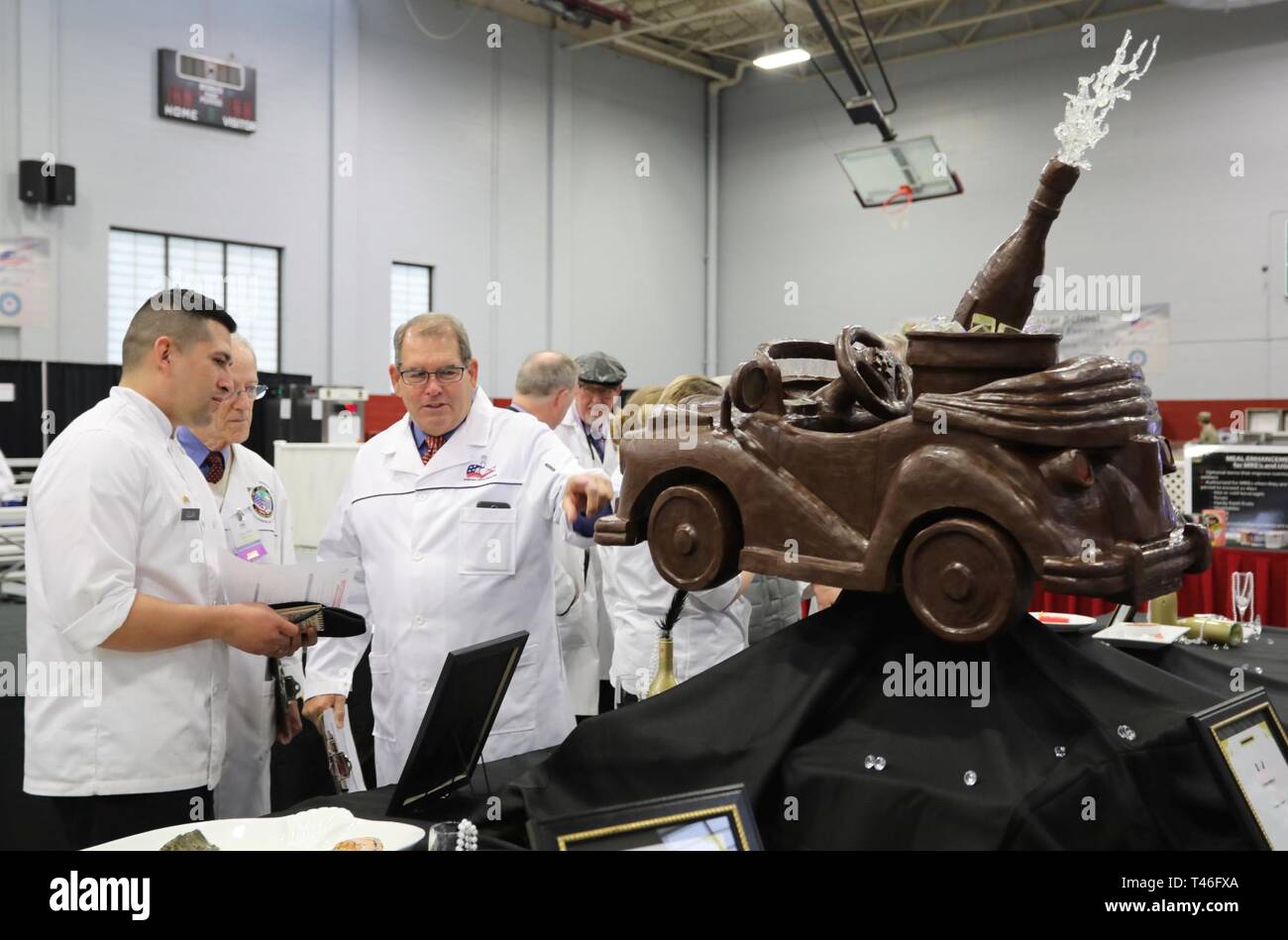 An American Culinary Federation (ACF) judge gives a critique to Sgt ...
