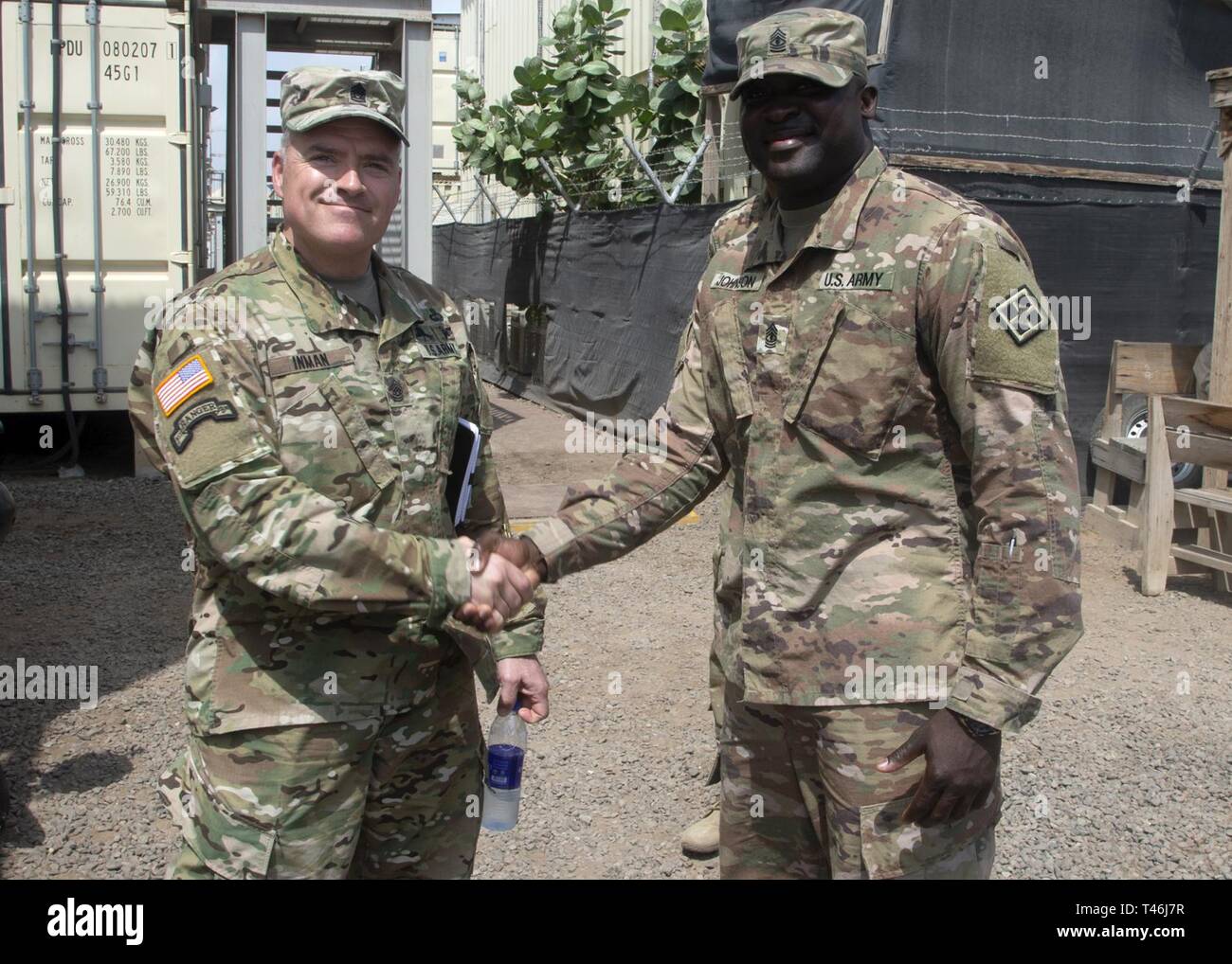 U.S. Army Command Sgt. Maj. Jeremiah E. Inman, left, command sergeant ...