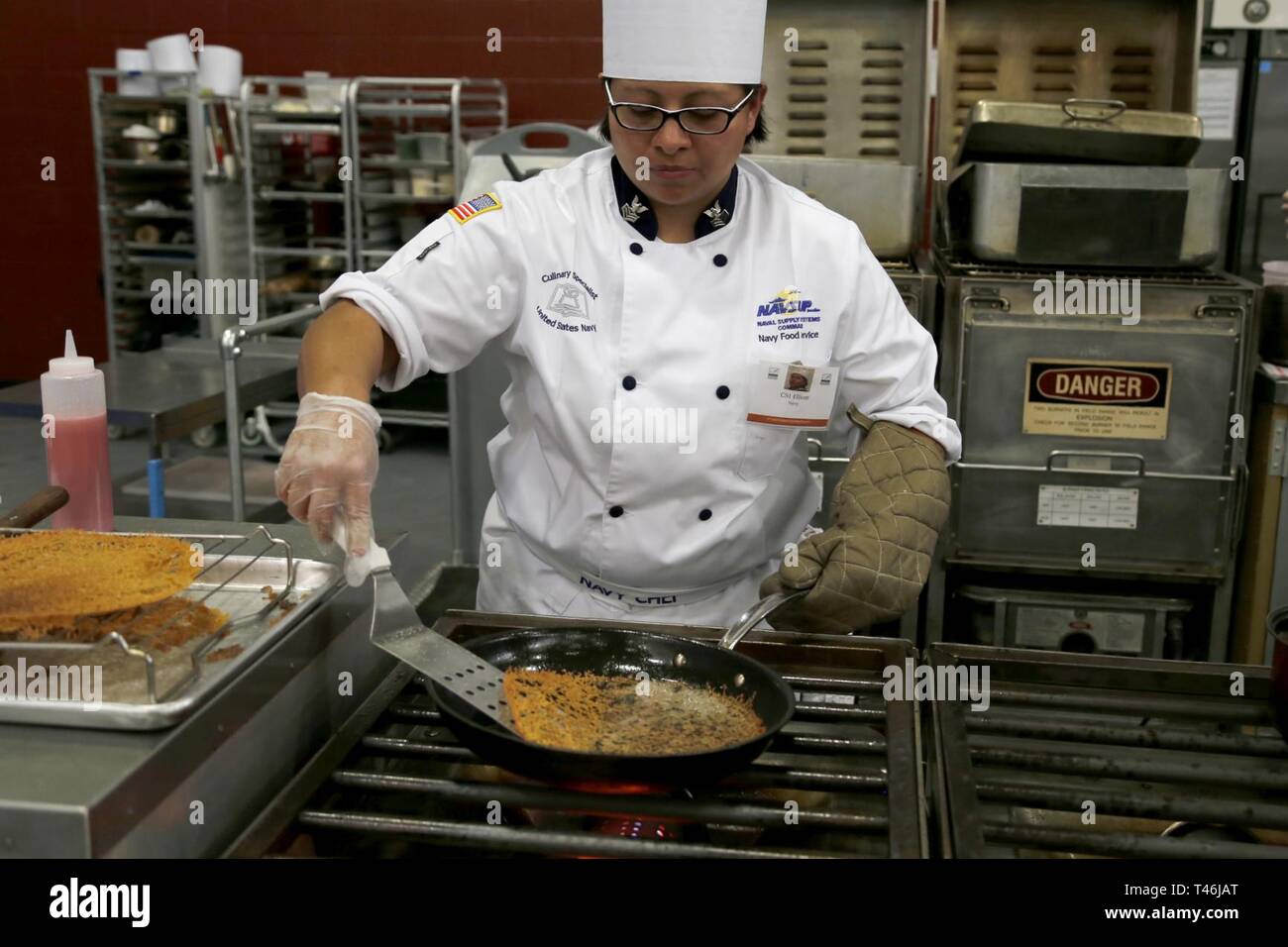 U.S. Navy Culinary Specialist 1st Class Hermila Elliott prepares tuile ...