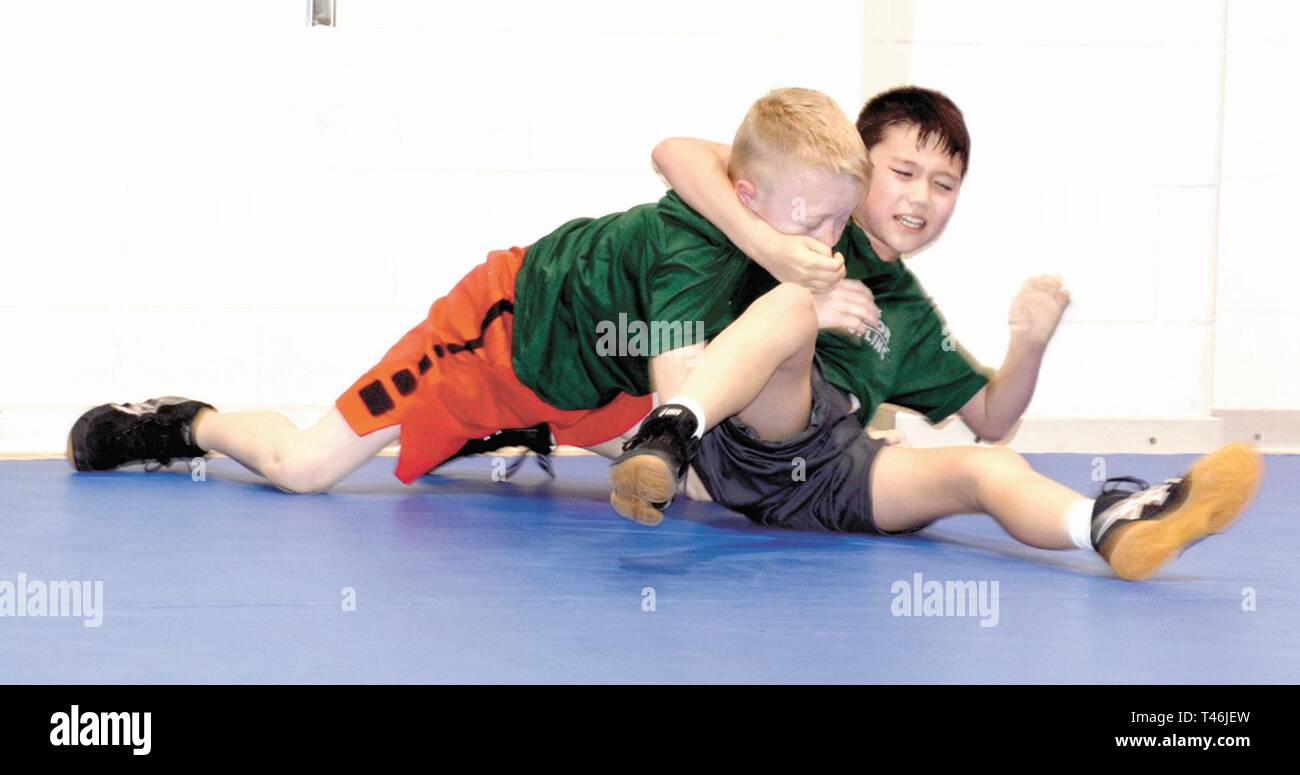 Jaxson Horne (left) and Darius Hickman grapple during wresting practice ...