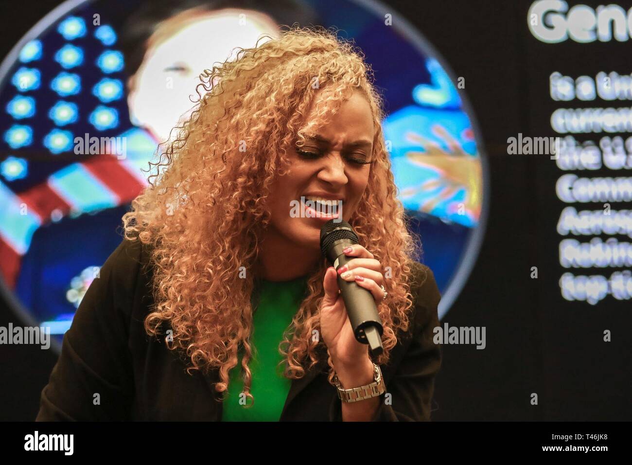 Jennifer Edwards, U.S. Army Central, sings the National Anthem during ...