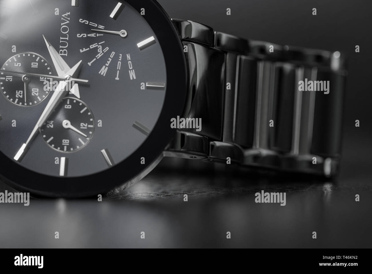 A Bulova watch laying on a dark grey surface Stock Photo - Alamy