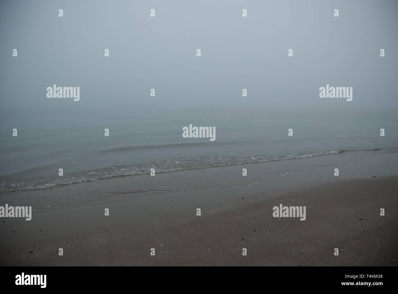 Fog on the sea, beach in winter season Stock Photo - Alamy