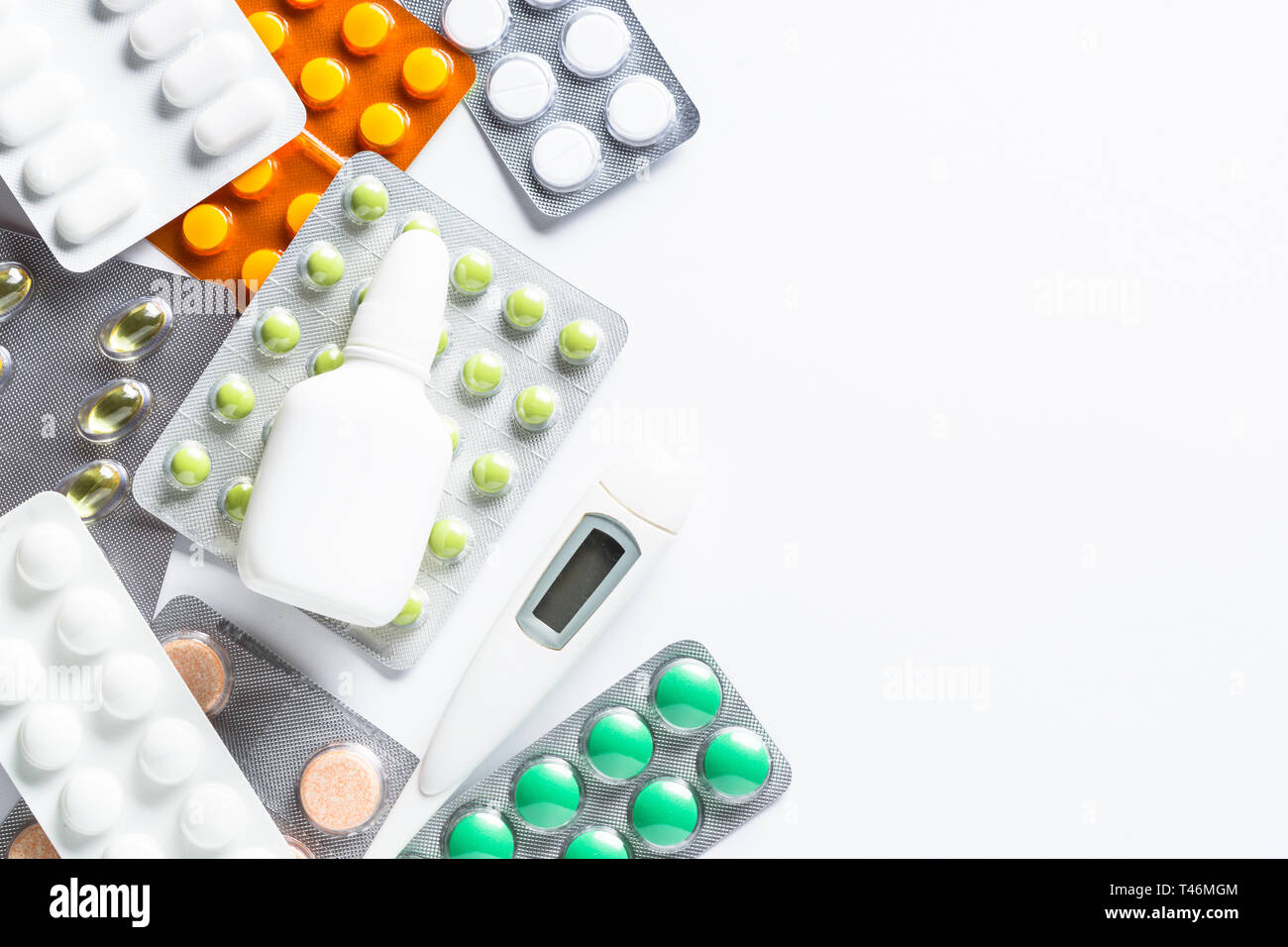 Tablets and medicines on a white top view Stock Photo - Alamy